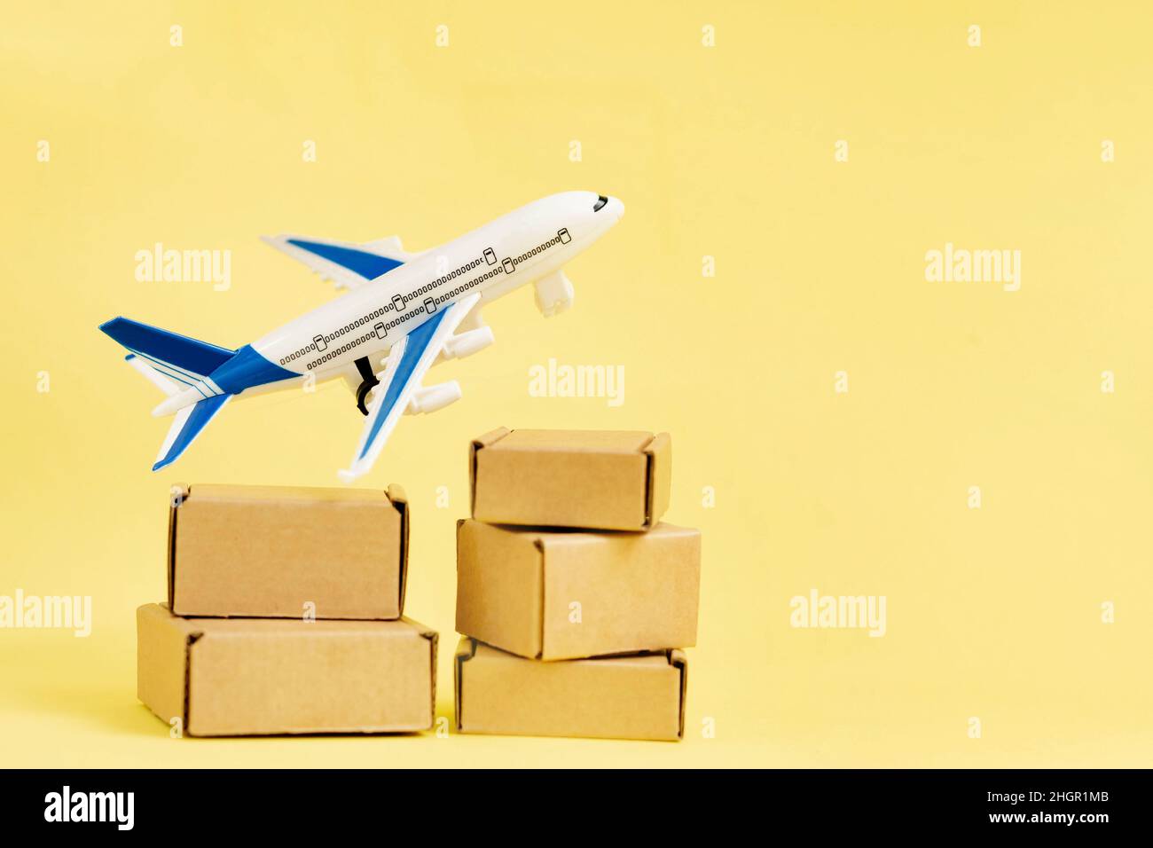 Airplane and stack of cardboard boxes. concept of air cargo and parcels ...