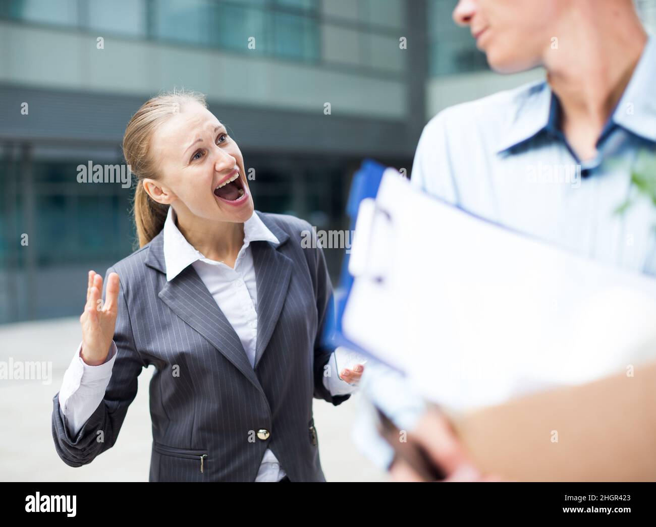 Angry businesswoman is chastising the employee Stock Photo - Alamy