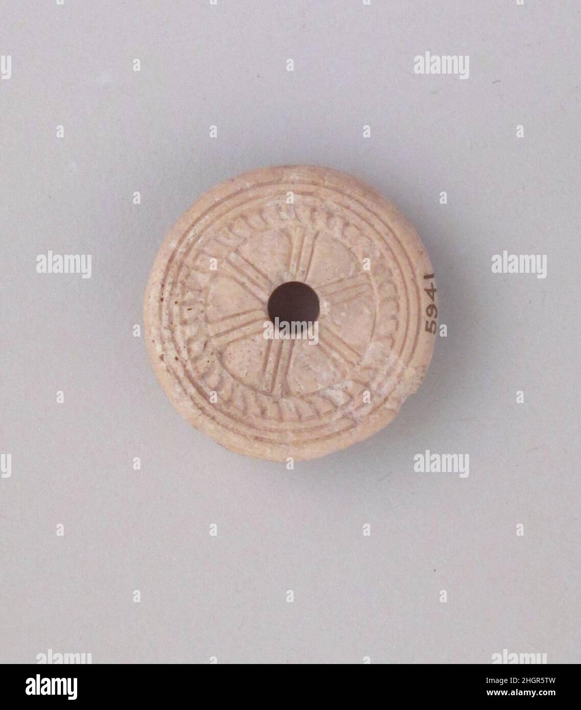 Spindle whorl Cypriot. Spindle whorl. Cypriot. Bone Stock Photo - Alamy