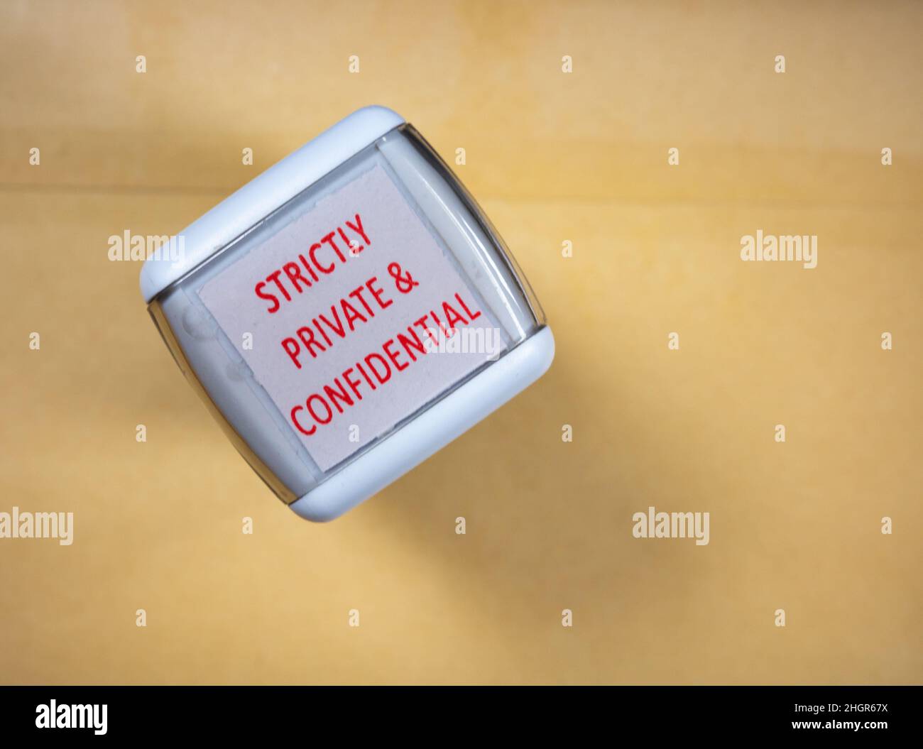Top down view on a Strictly Private and Confidential ink stamp on a ...
