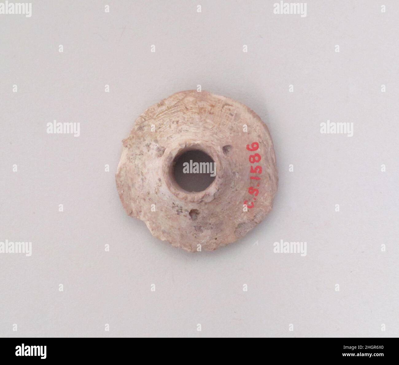 Spindle whorl. Spindle whorl. Bone Stock Photo - Alamy