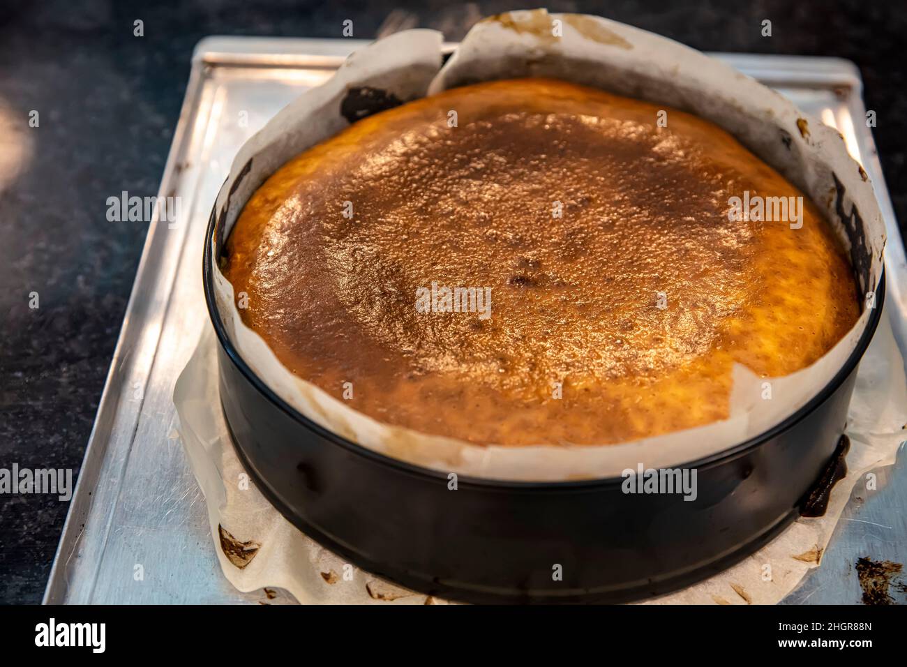 Cooking process homemade Basque burnt cheesecake. Ready toasted san ...