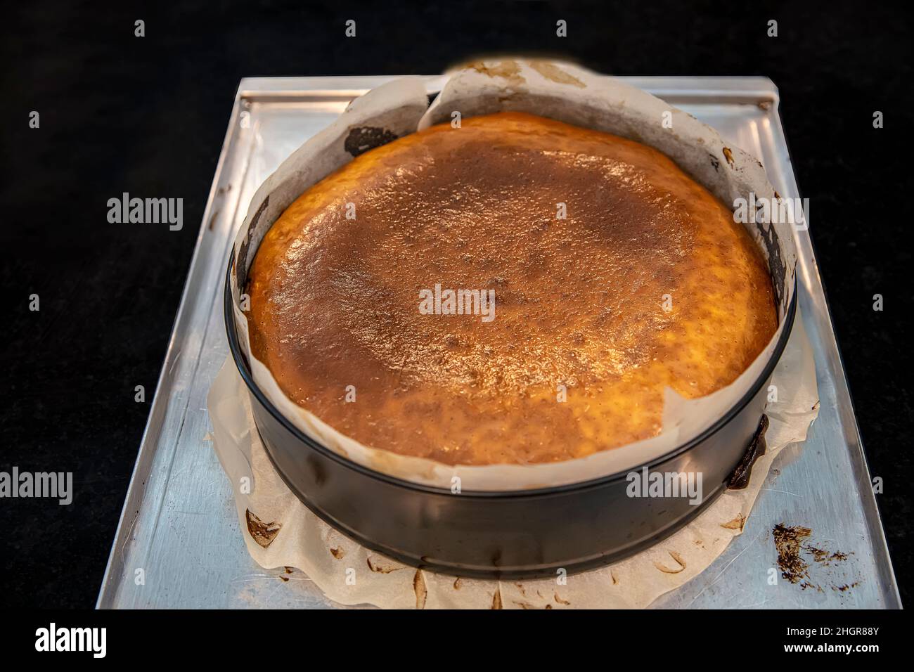 Cooking process homemade Basque burnt cheesecake. Ready toasted san ...