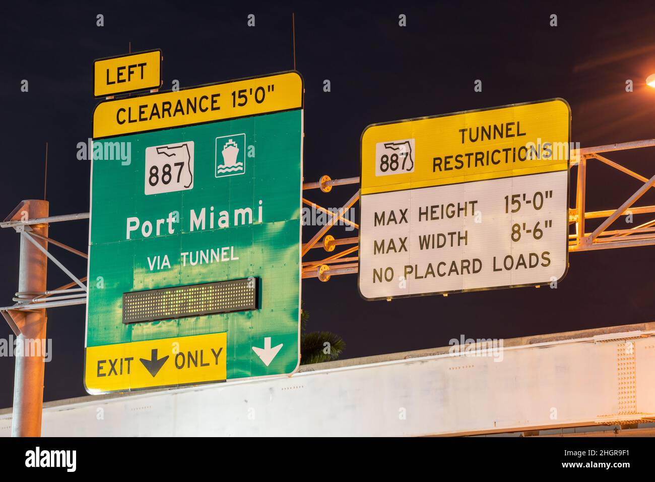Highway sign from Downtown to Port Miami via Macarthur Causeway Stock ...