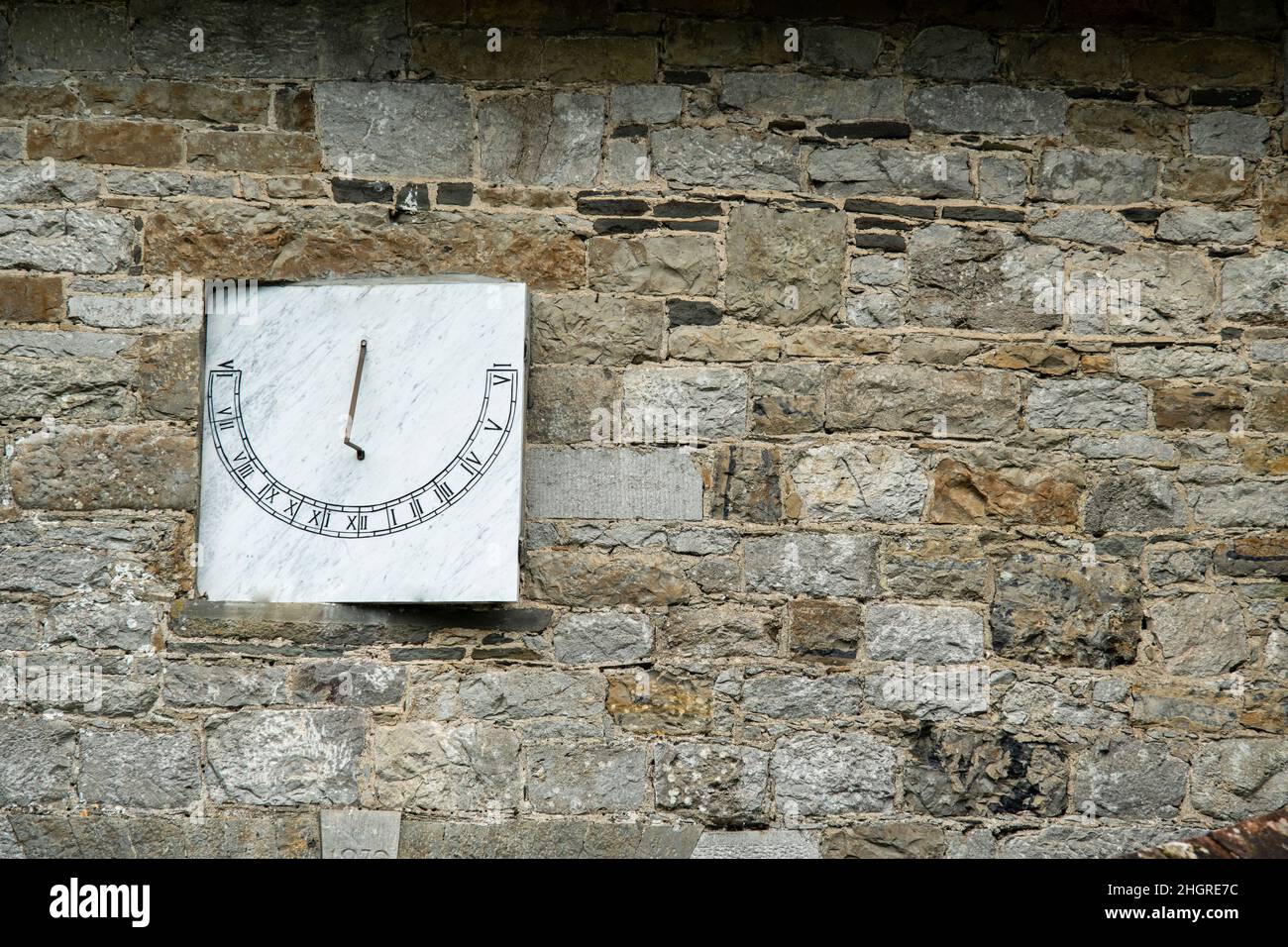 Sundial hanging on the wall of the building Stock Photo - Alamy