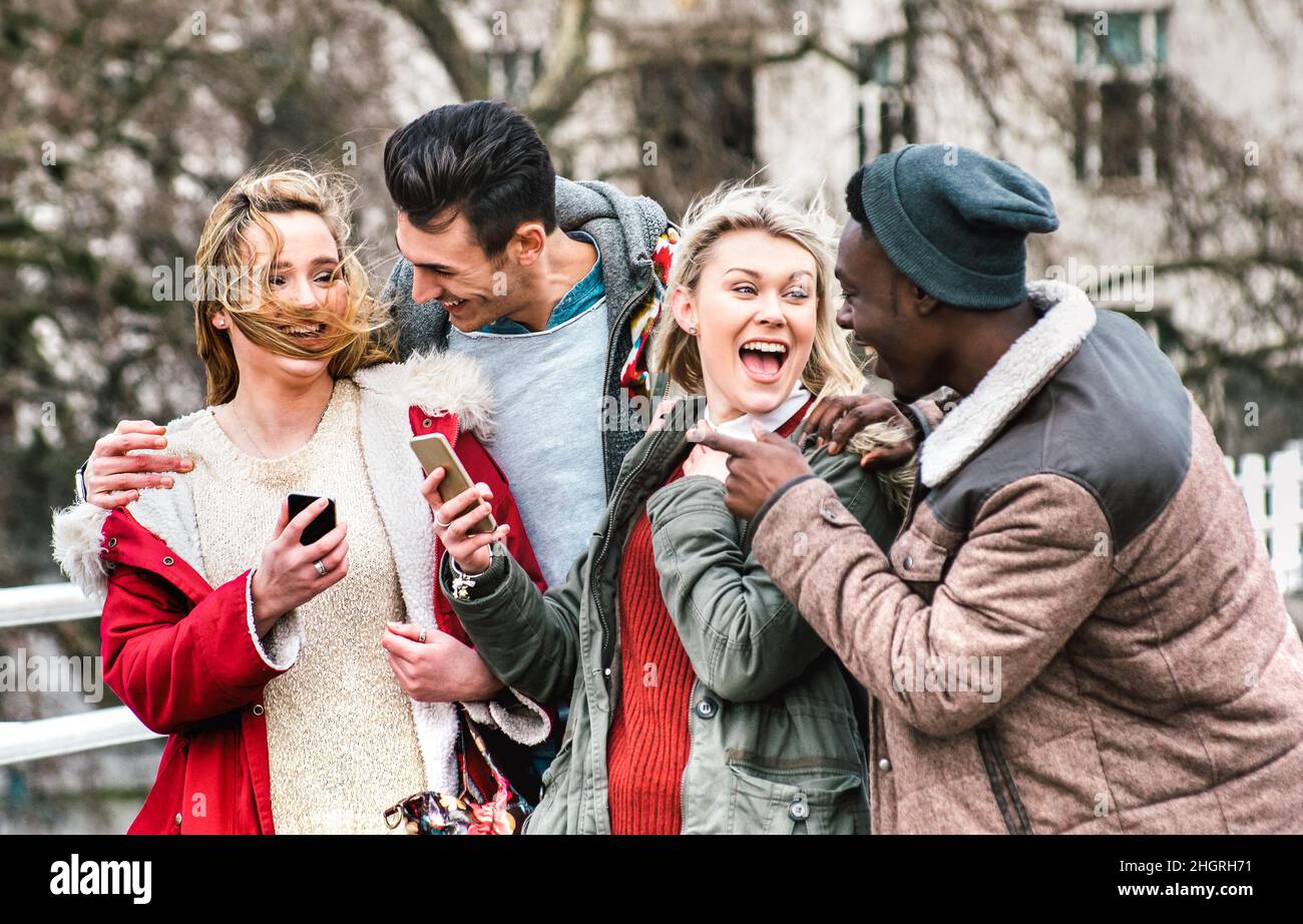 Multicultural group of milenial friends walking at London city center ...