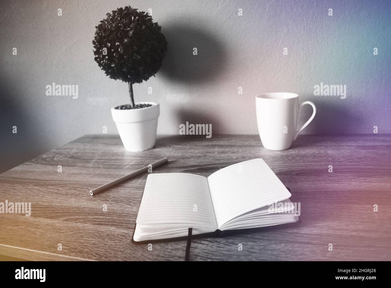 Open notebook with a pen on a desk Stock Photo - Alamy