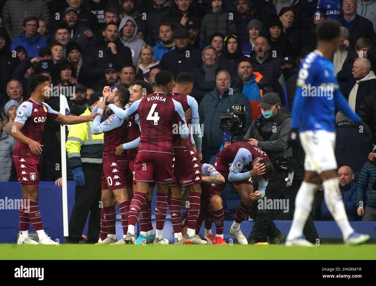 Aston Villa's Matty Cash (second right) is hit with a bottle while ...