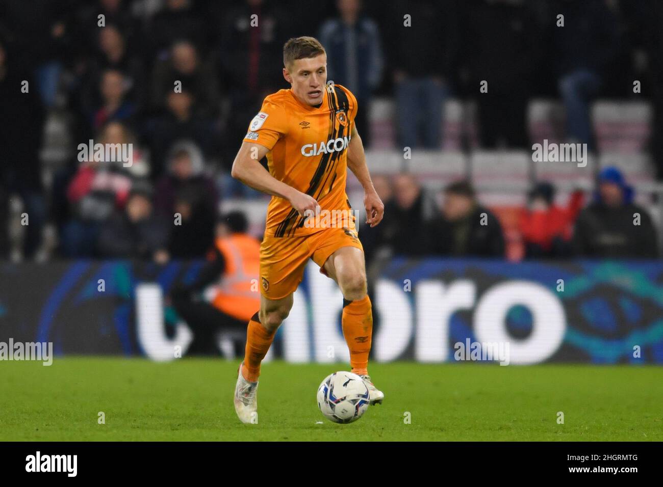 Greg Docherty #8 of Hull City runs forward with the ball Stock Photo ...