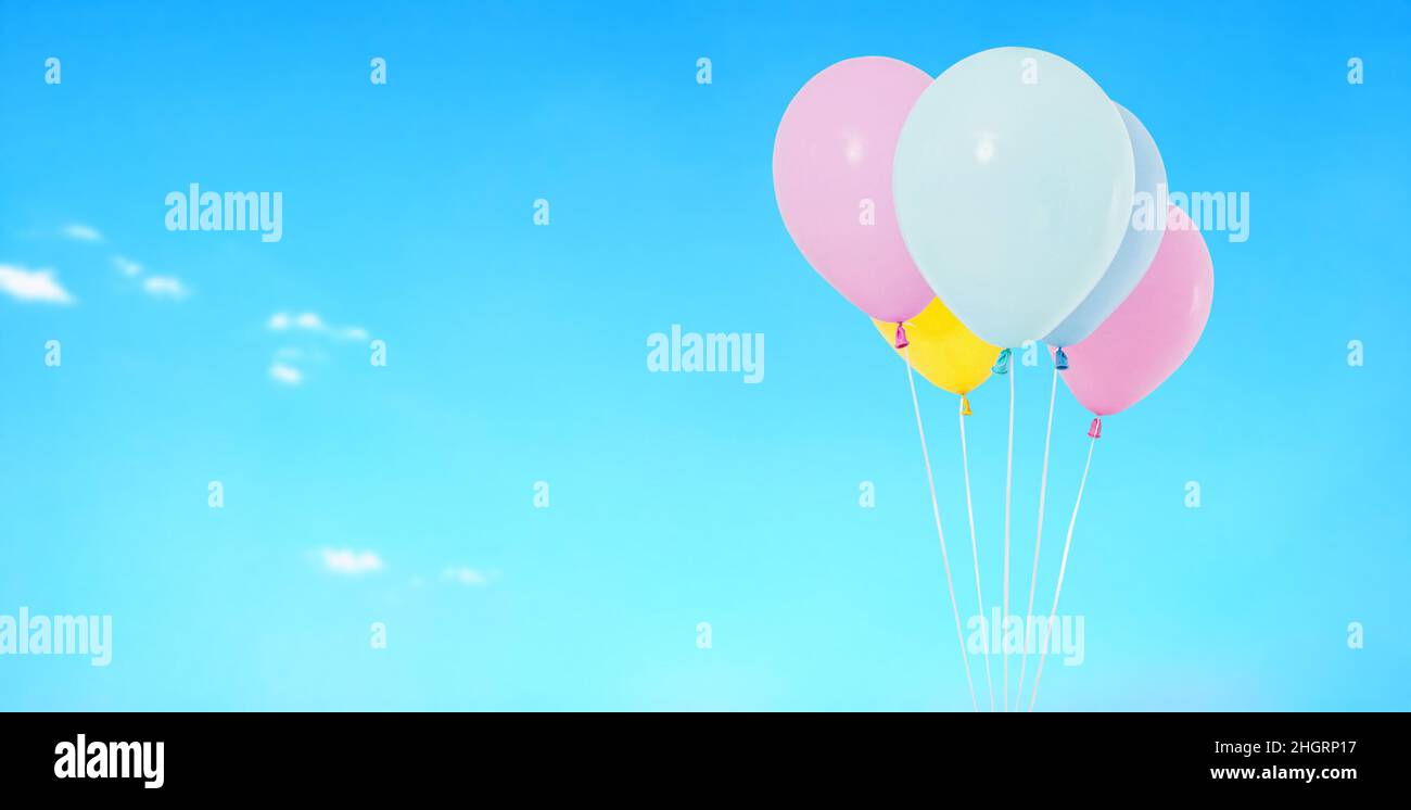 Flying coloured balloon on blurred sky background Stock Photo - Alamy