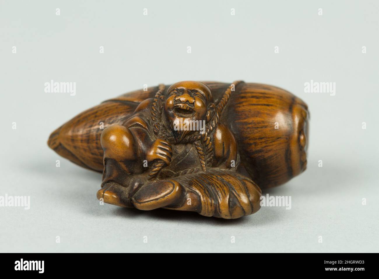 Netsuke of Old Man Carrying a Very Large Acorn 19th century Japan ...