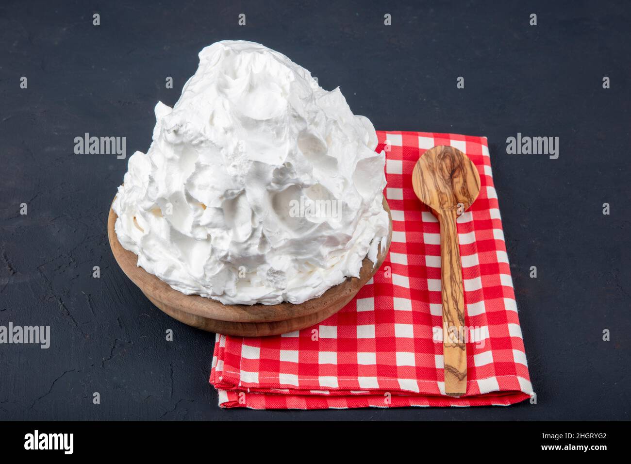 Powdered cream (Powder Cream) whipped cream in plate on wooden floor ...