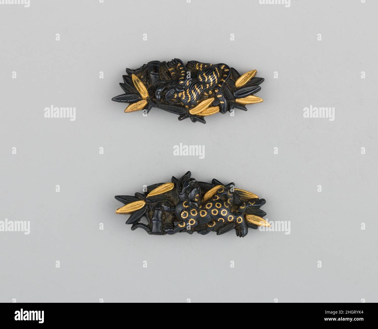 Pair of Sword-Grip Ornaments (Menuki) 17th century Japanese Menuki are a pair of ornamental ...