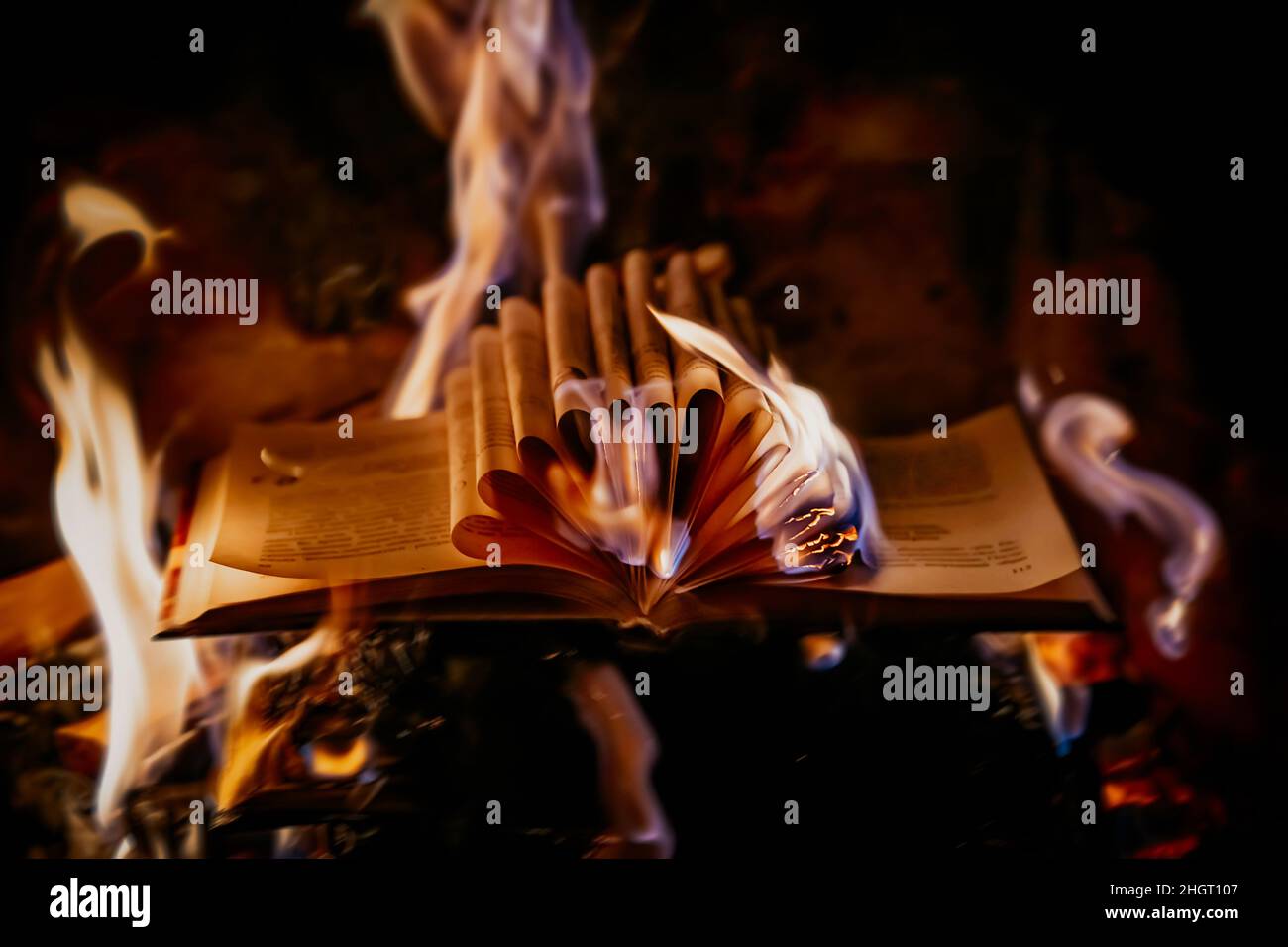 Old open book is burning. Big bright flame on papers. Destruction of ...