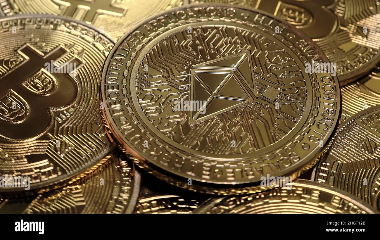 ETH, Ethereum coin on bitcoins background, cryptocurrency investing ...