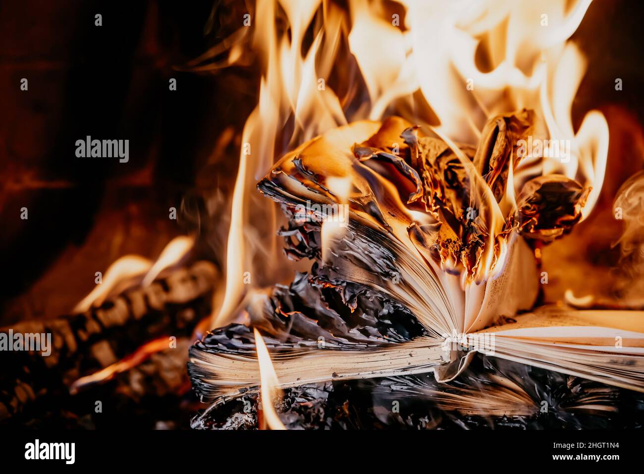Old open book is burning. Big bright flame on papers. Destruction of ...