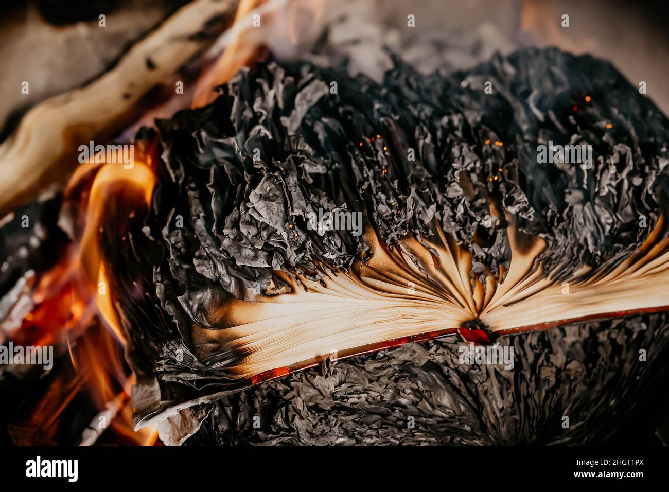 Old open book is burning. Big bright flame on papers. Destruction of ...