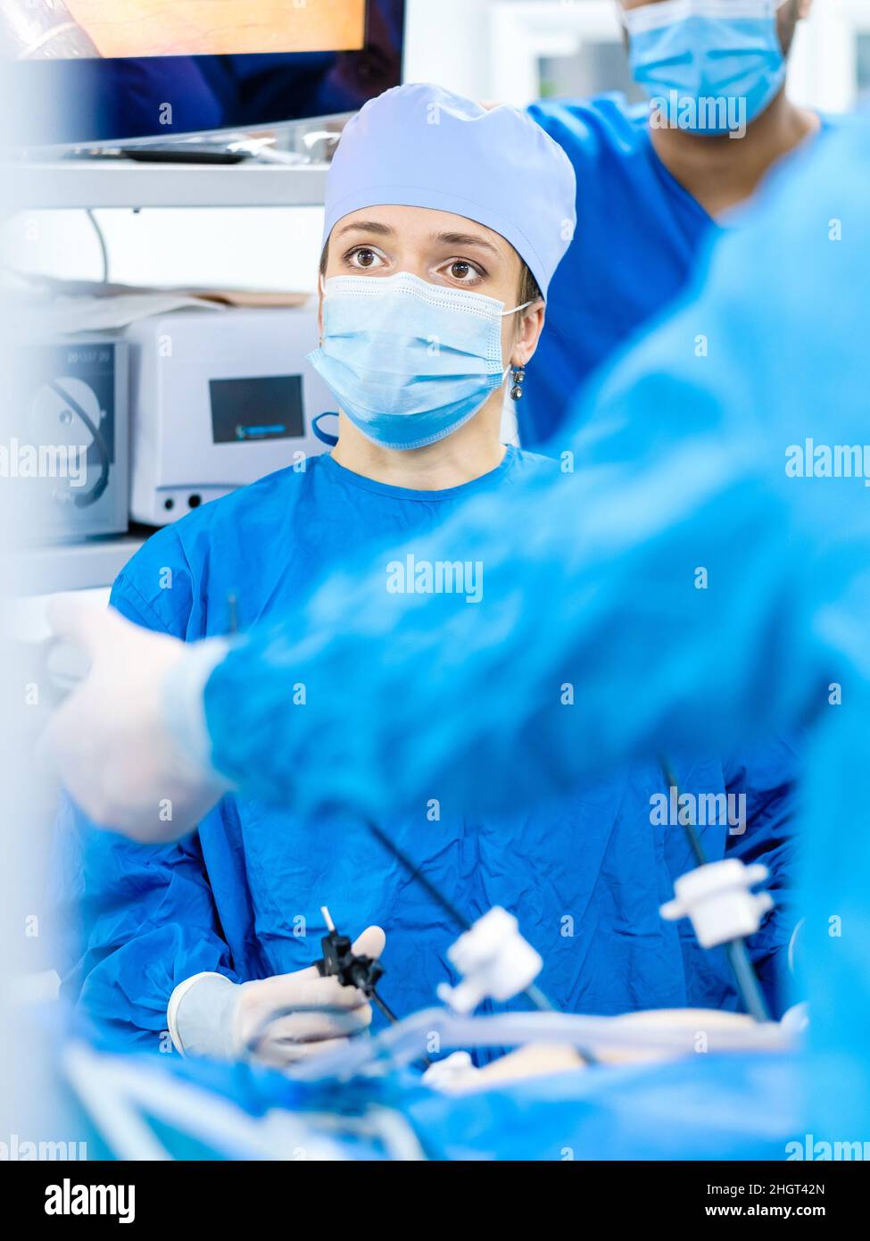 Portrait of a female surgeon during laparoscopic surgery. A female ...