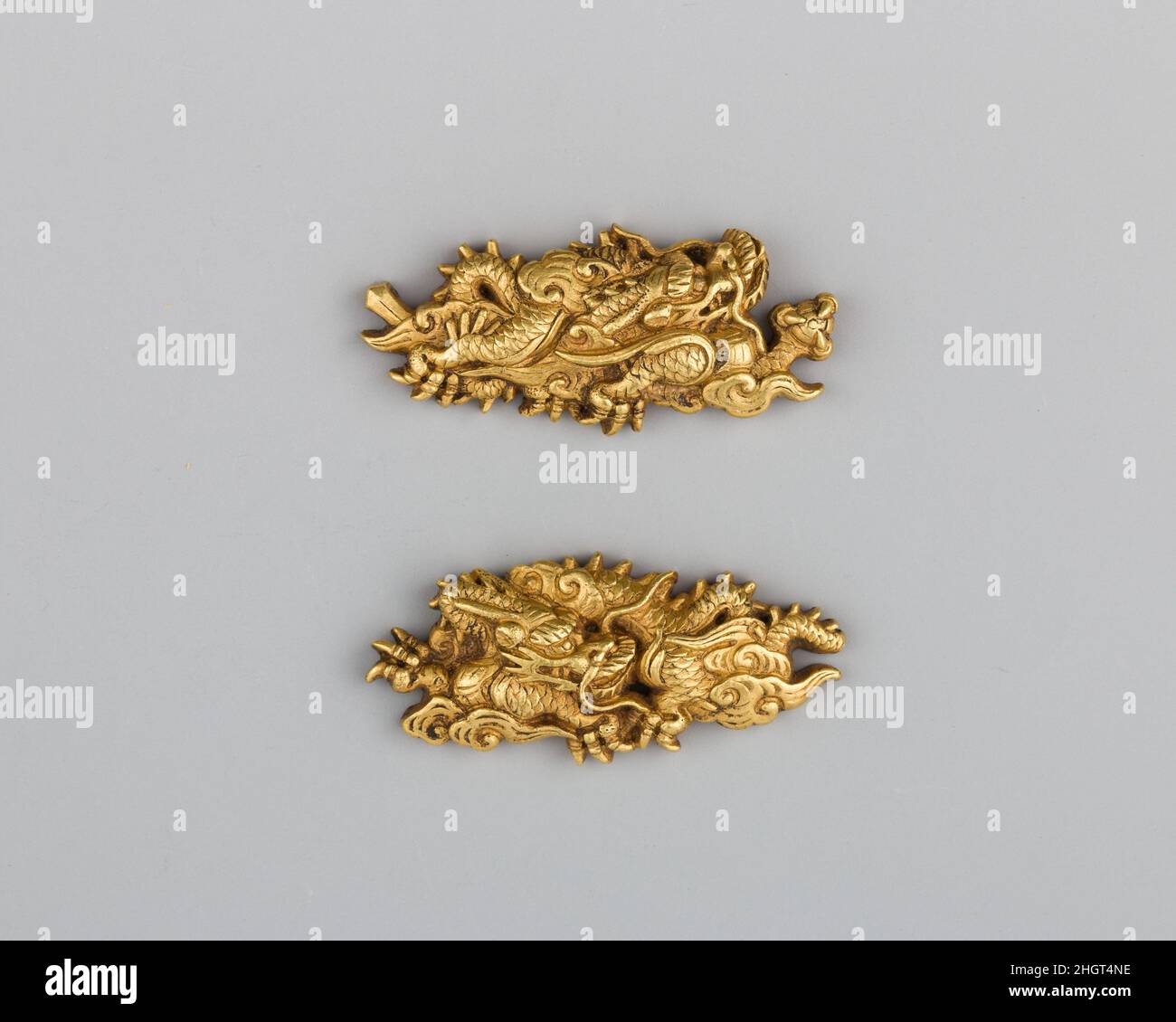 Pair of Sword-Grip Ornaments (Menuki) possibly early 17th century Japanese Menuki are a pair of ...