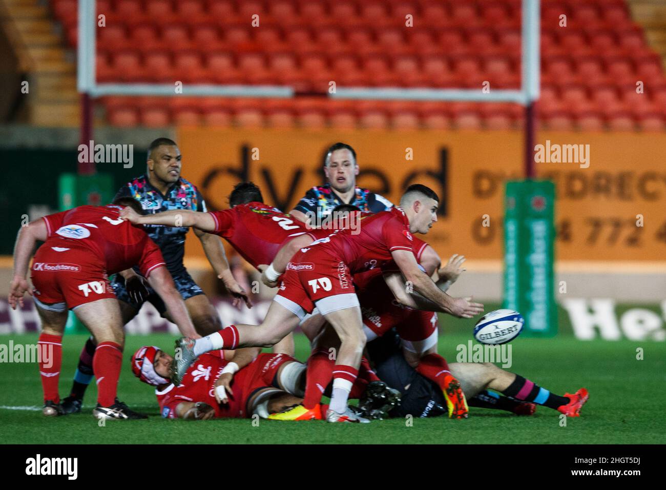 Llanelli, UK. 22 January, 2022. Scarlets scrum half Dane Blacker passes ...