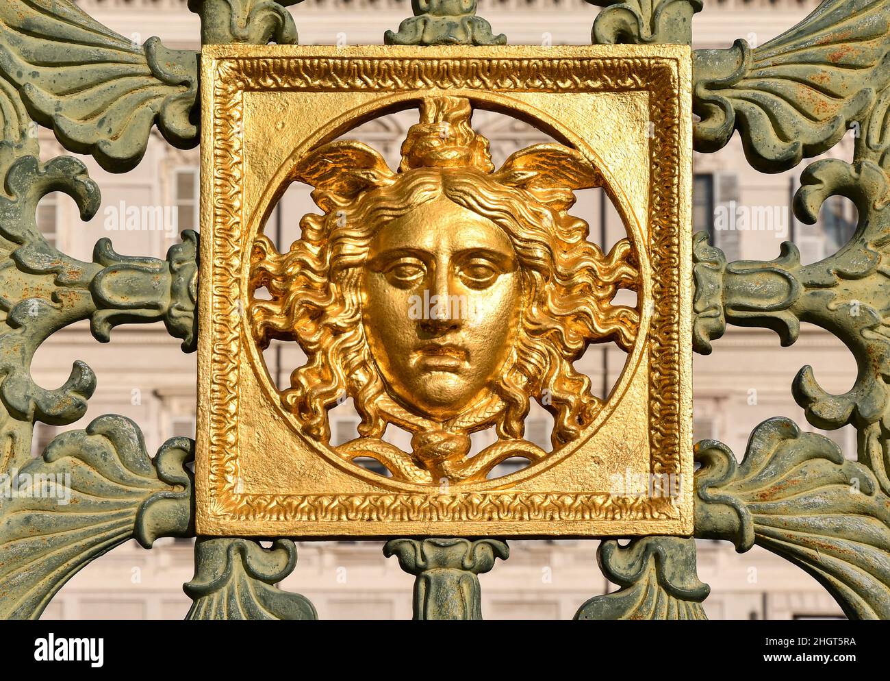 Detail of the monumental gate of Palazzo Reale, decorated with a golden ...