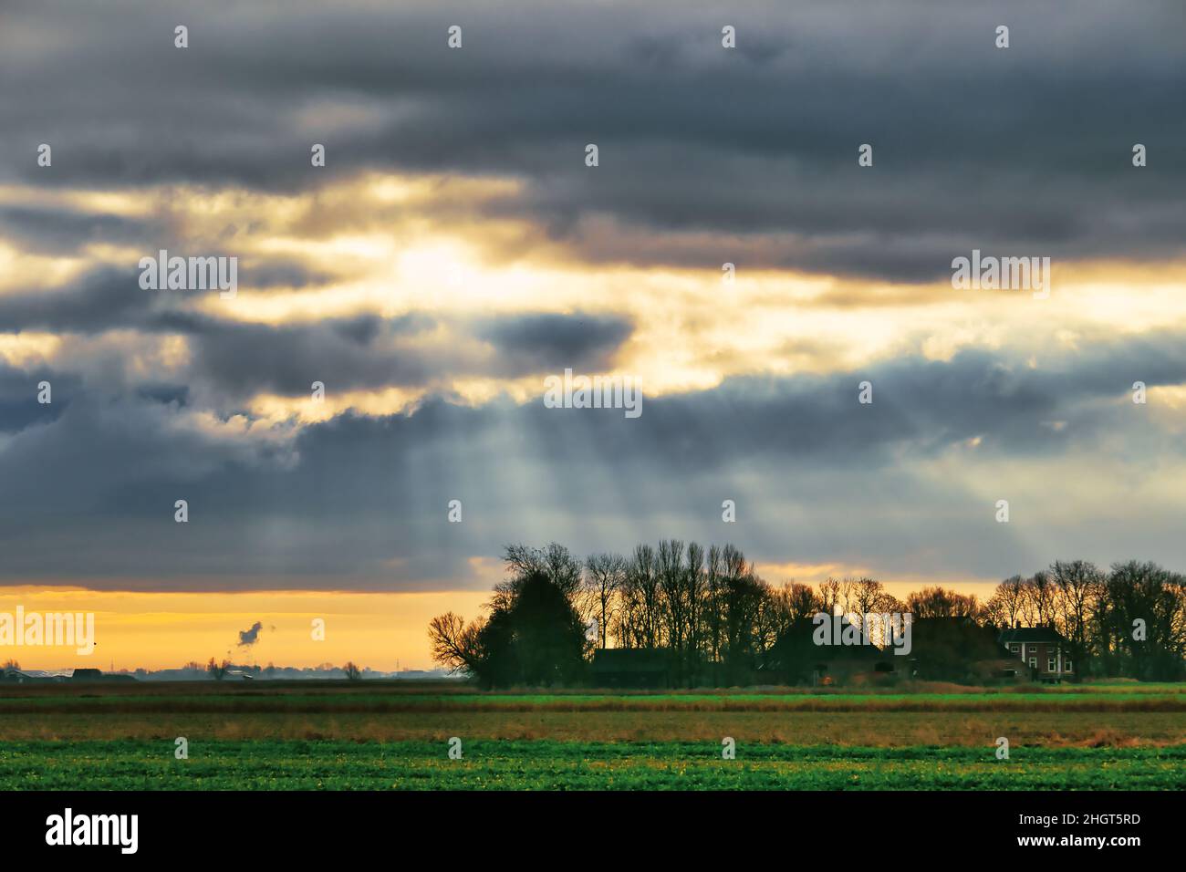 Sun rays through dark clouds hi-res stock photography and images - Alamy