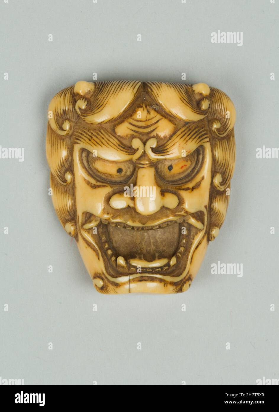 Netsuke of Mask of a Man with Open Mouth and Curly Hair 19th century ...