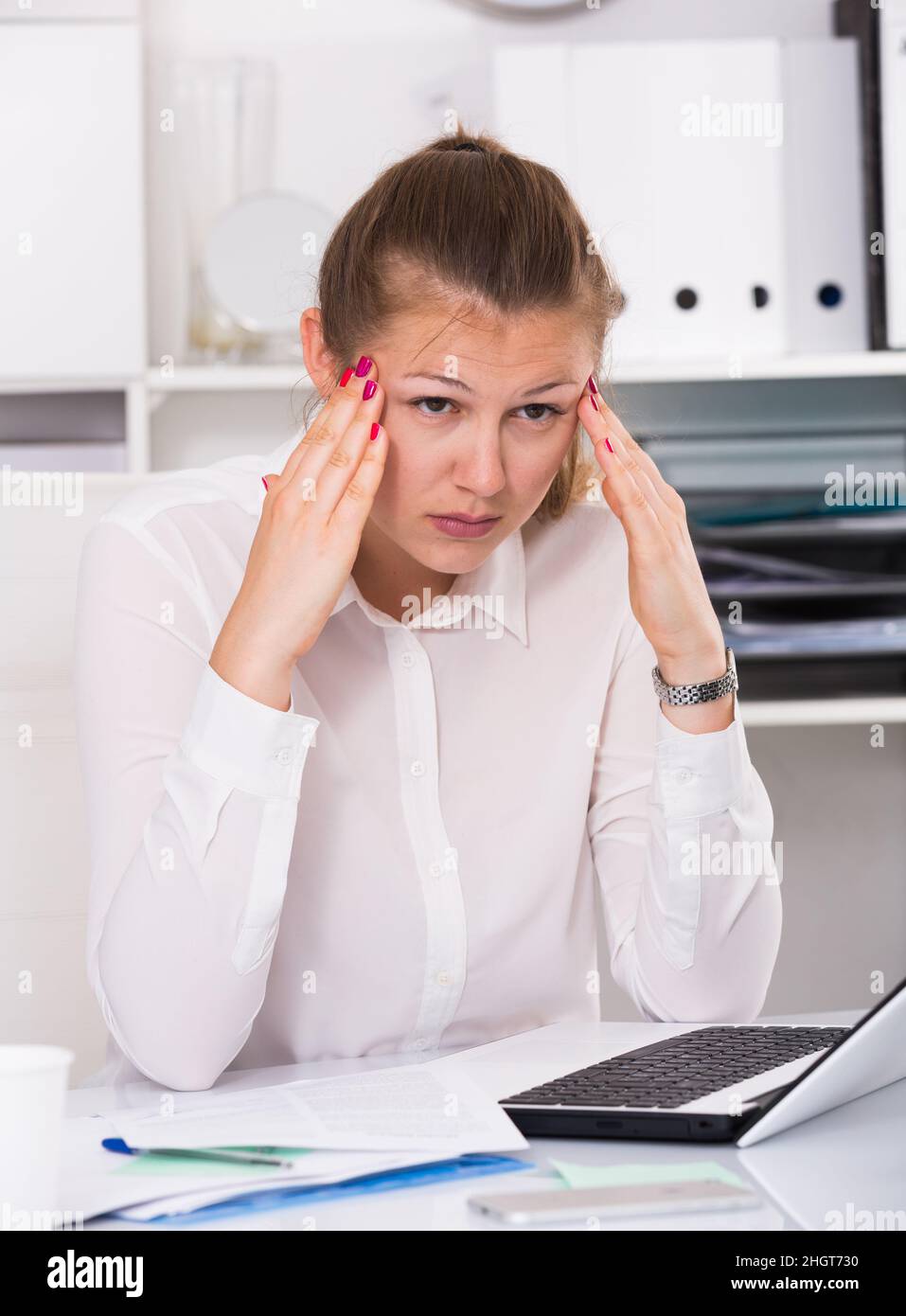 Female office worker is having complicated issue with project Stock ...