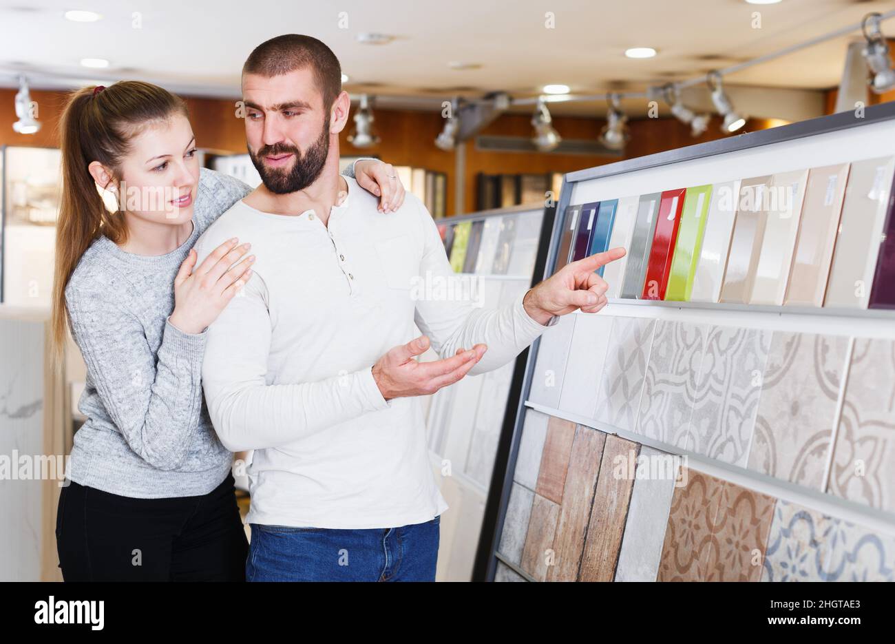 family choosing ceramic tile Stock Photo - Alamy