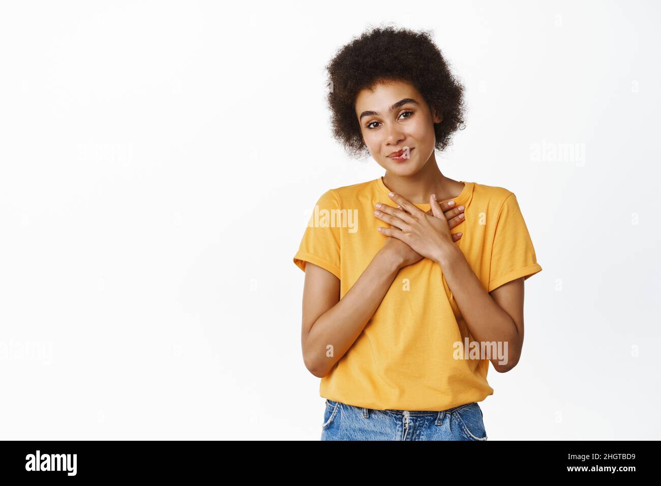 Portrait of beautiful girl showing her appreciation, gratitude, holding ...
