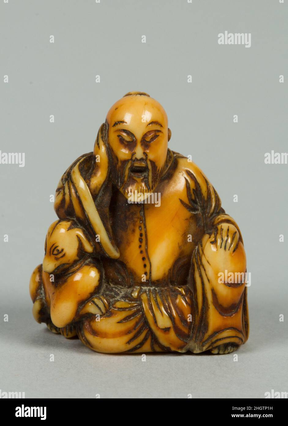 Netsuke of Seated Figure of Old Man with a Dog 19th century Japan ...
