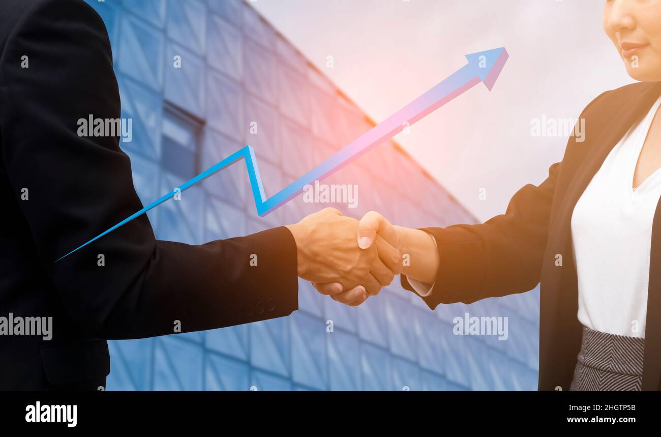 Double exposure of business Partner handshake between a man and a woman on blue sky background ...