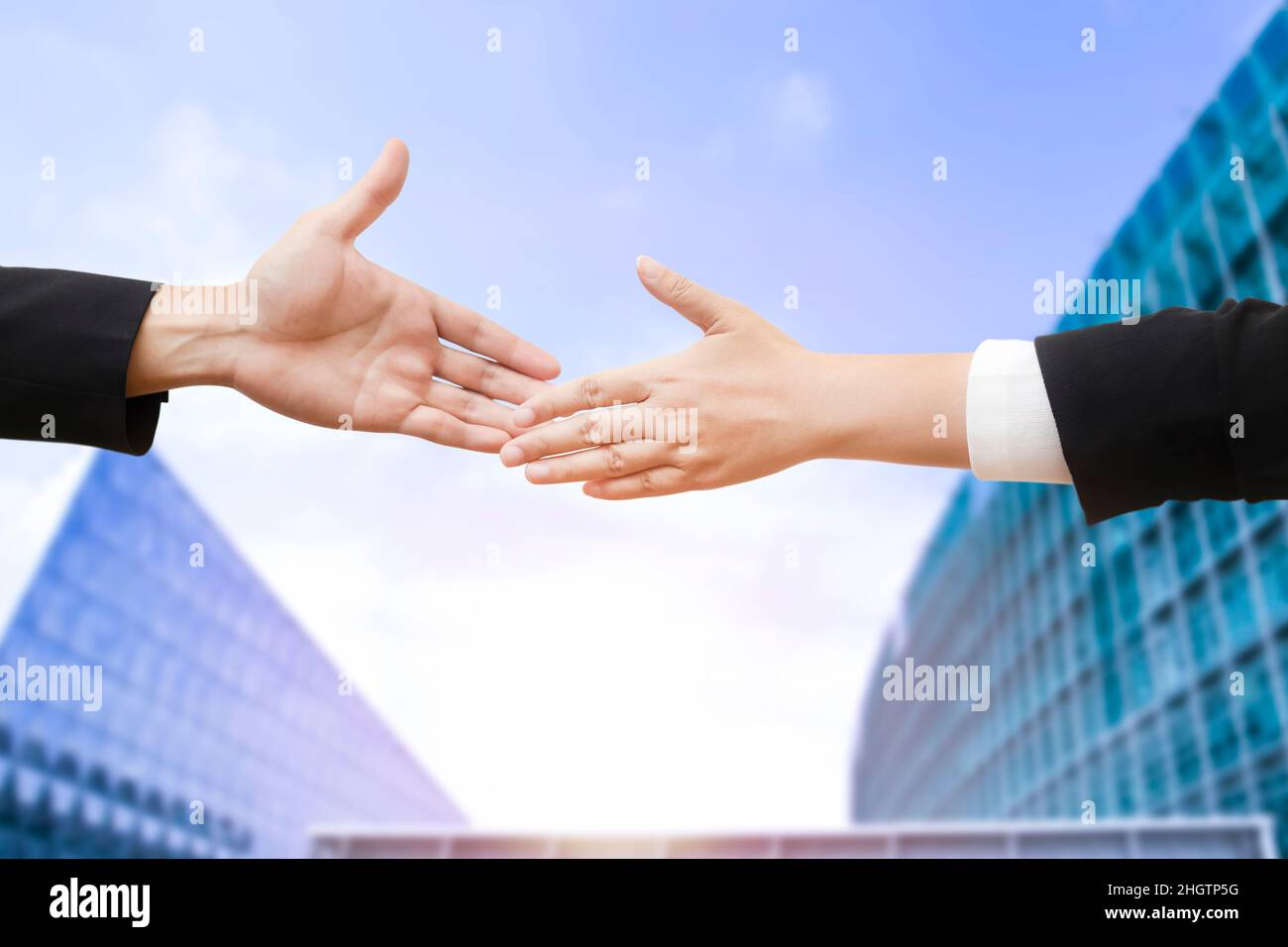 Double exposure of business Partner handshake between a man and a woman ...