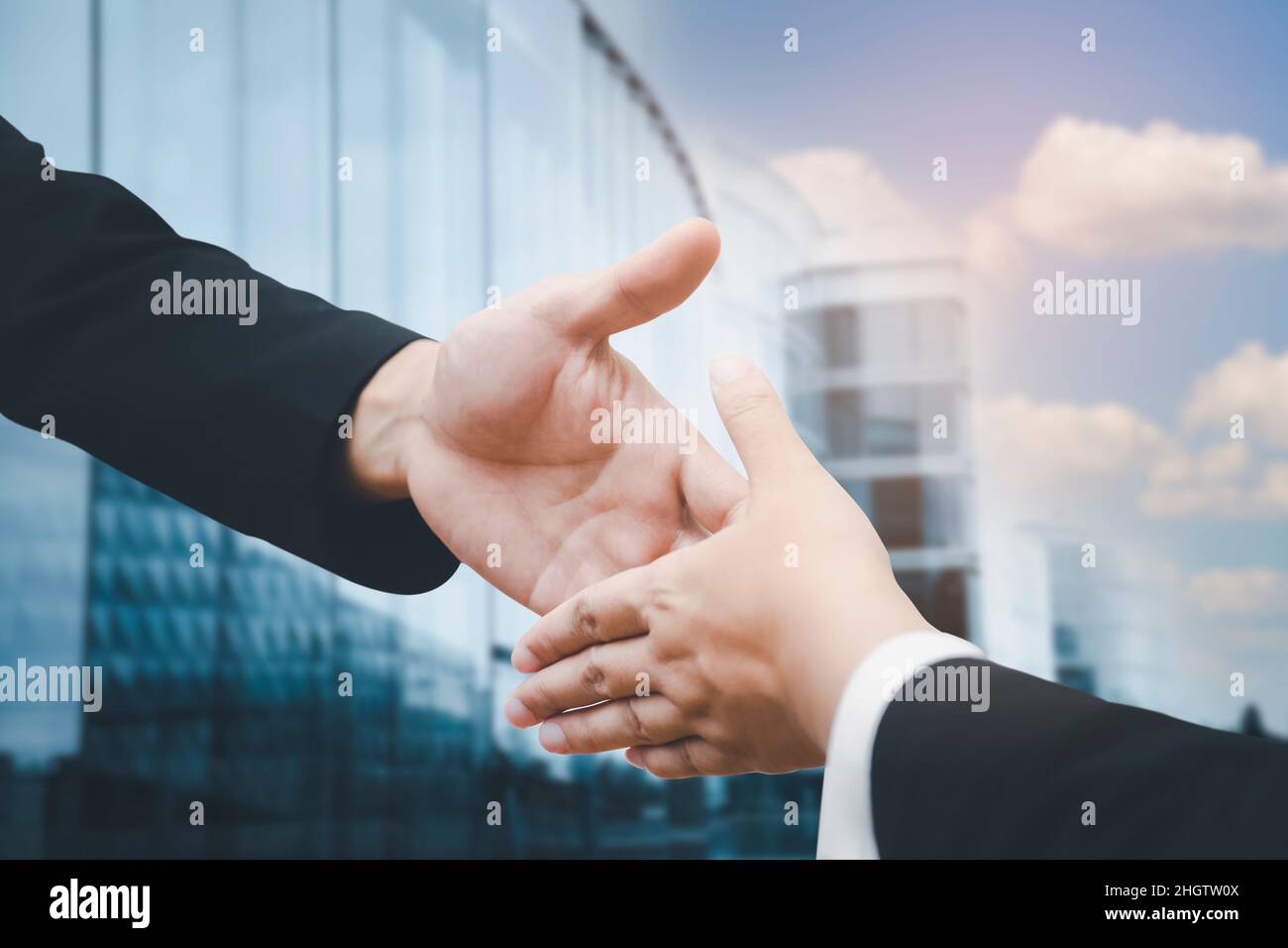 Double exposure of business Partner handshake between a man and a woman ...