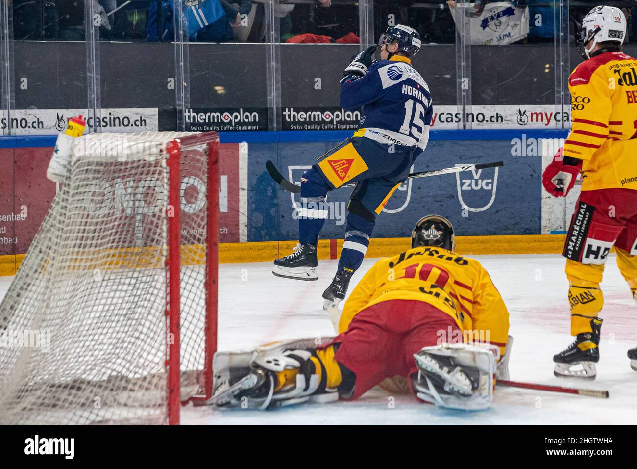 Gregory Hofmann #15 (EV Zug) cheers after his 2-0, #30 goalkeeper Louis ...