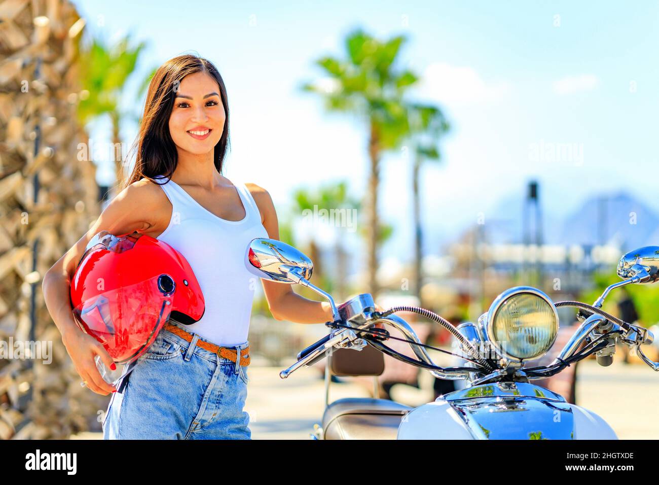 beautiful woman scooter rider drive a bike enjoy her tropicals weekends ...