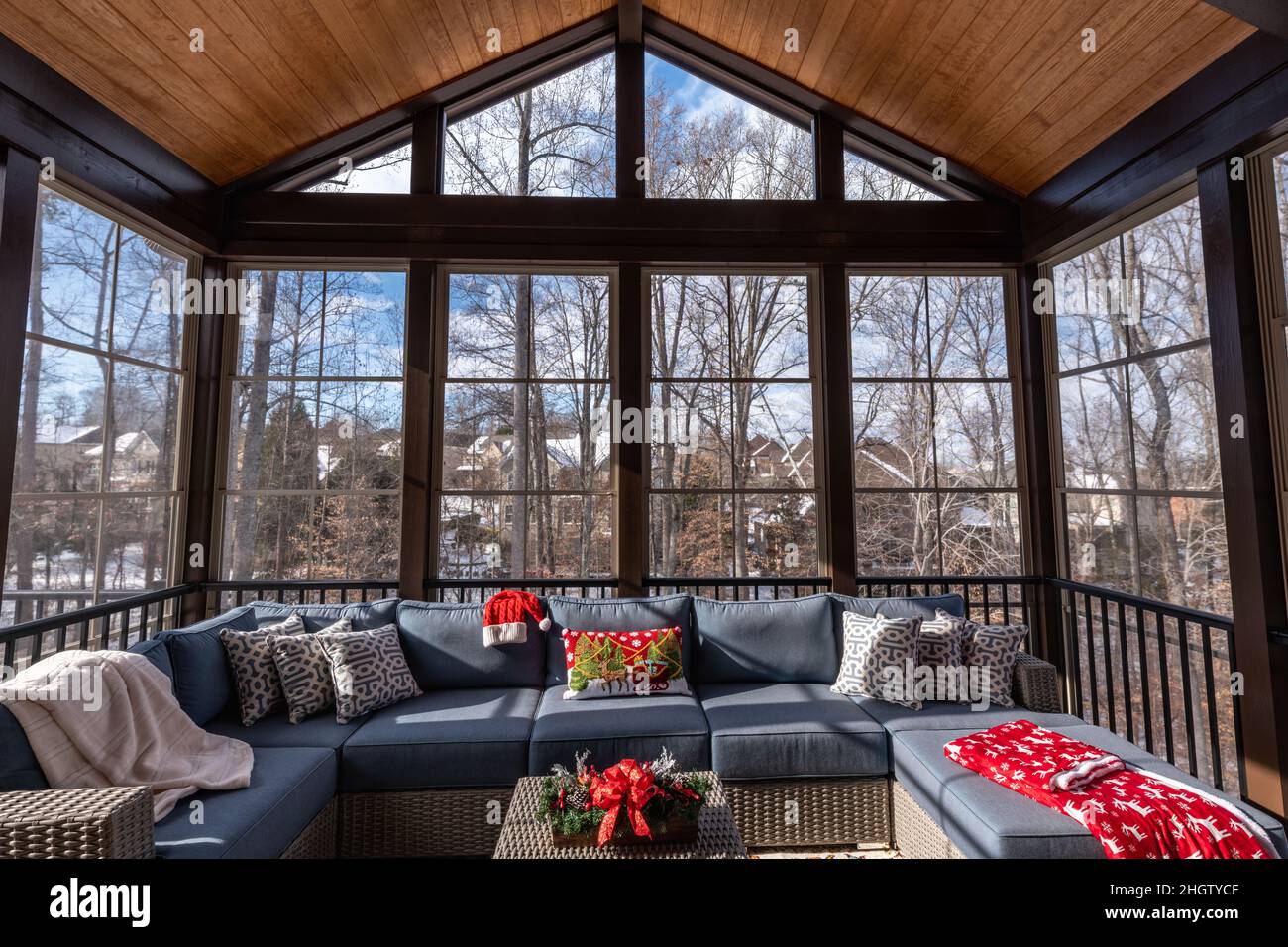 Cozy screened porch winter during Holidays season, snowy roofs and ...