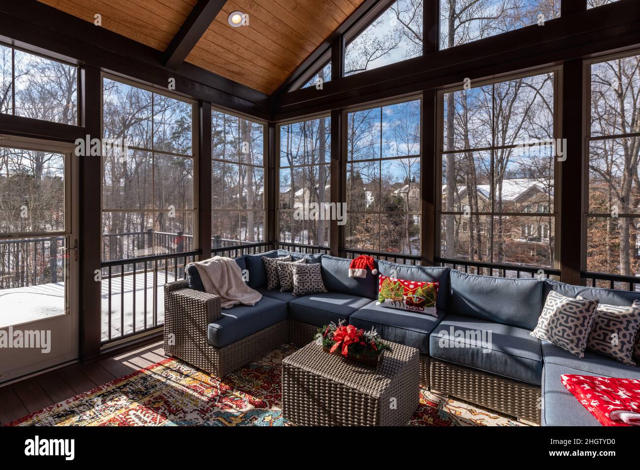 Cozy screened porch winter during Holidays season, snowy roofs and ...