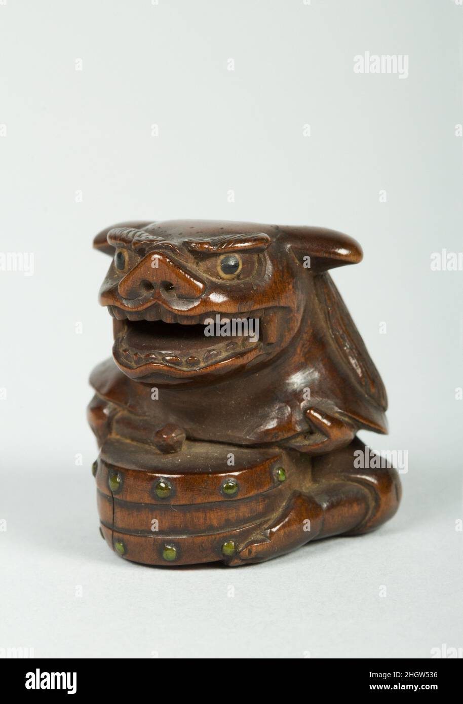 Netsuke of Man Wearing a Mask and Beating a Drum 18th century Japan ...