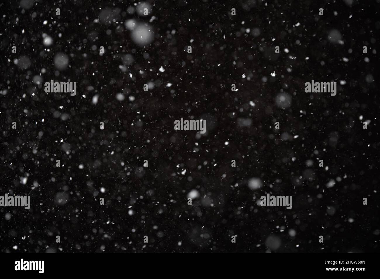 Snowfall on black background. Snowfall in the night sky, real ...