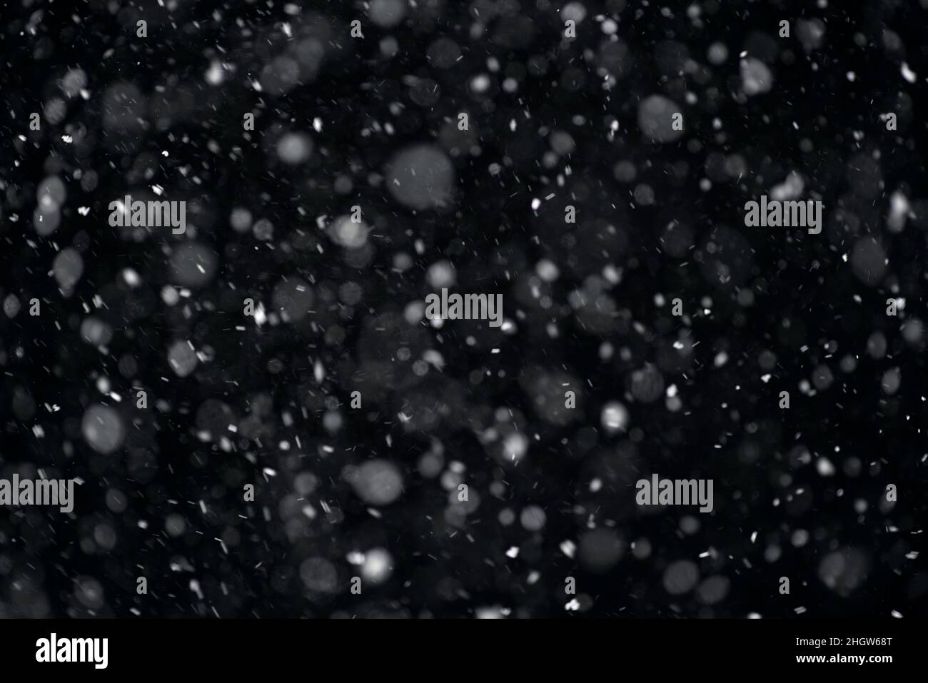 Snowfall on black background. Snowfall in the night sky, real ...