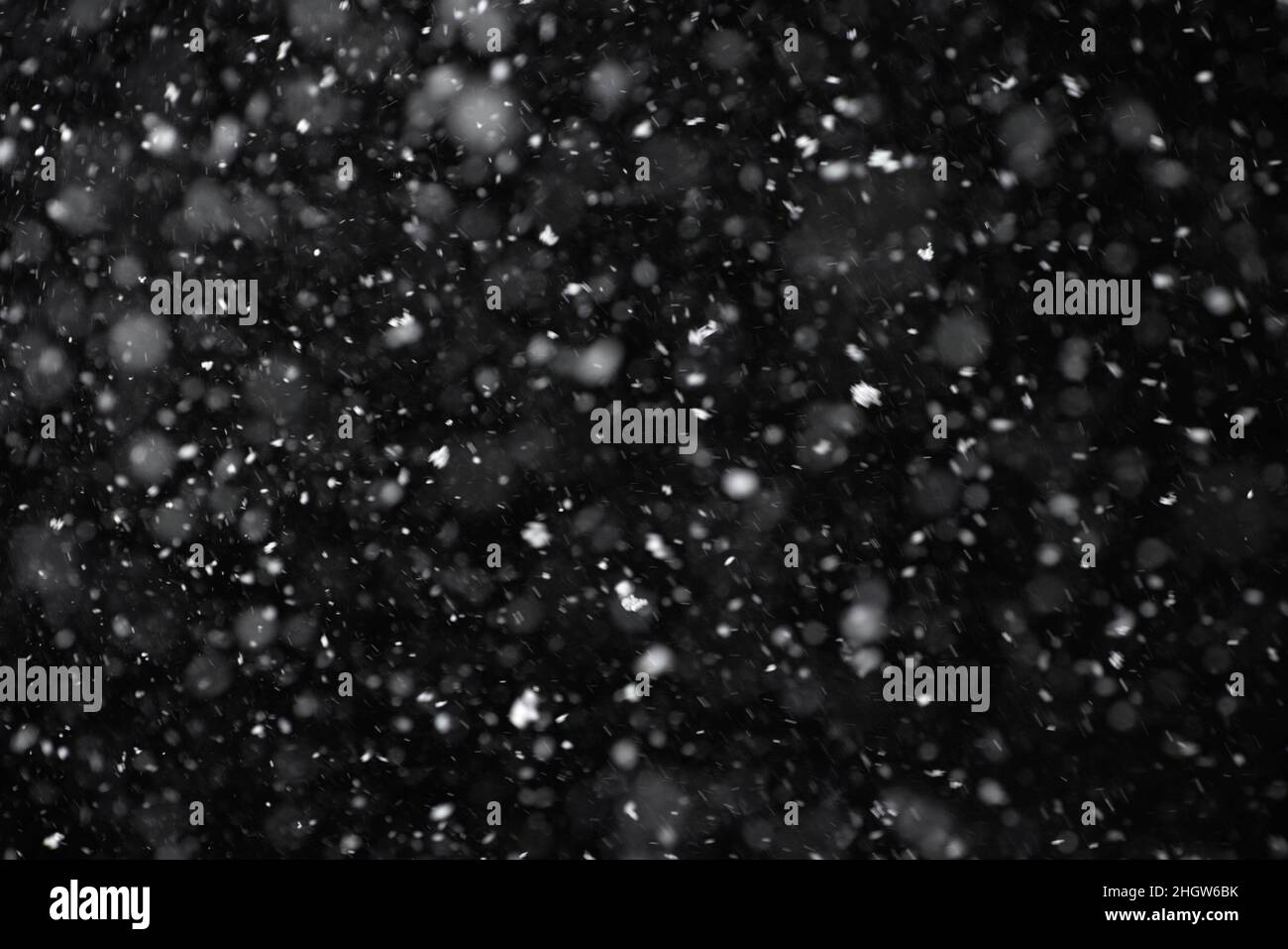Snowfall on black background. Snowfall in the night sky, real ...