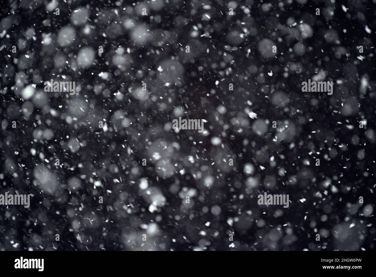 Snowfall on black background. Snowfall in the night sky, real ...