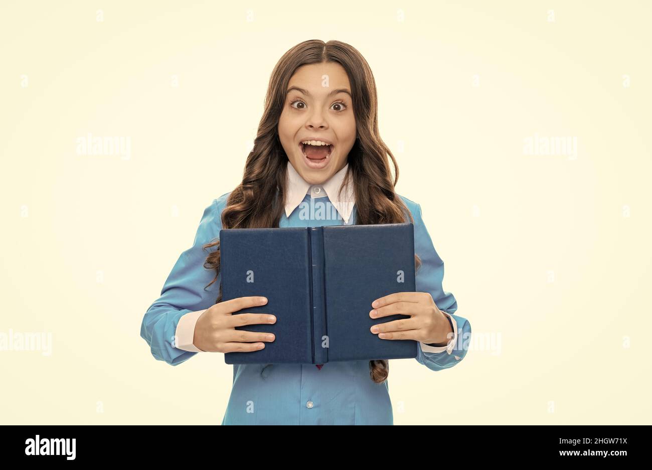 When getting a new book. Happy child hold book. Scholarly library ...