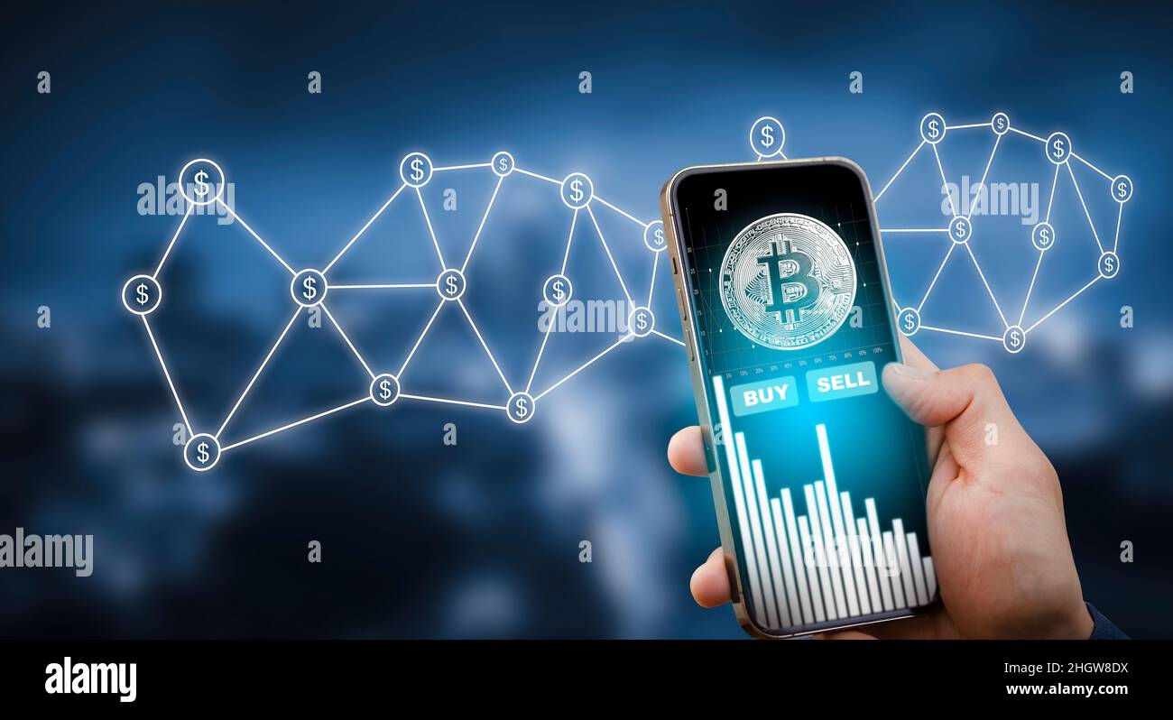 Smartphone with Bitcoin chart on-screen among piles of Bitcoin concept ...