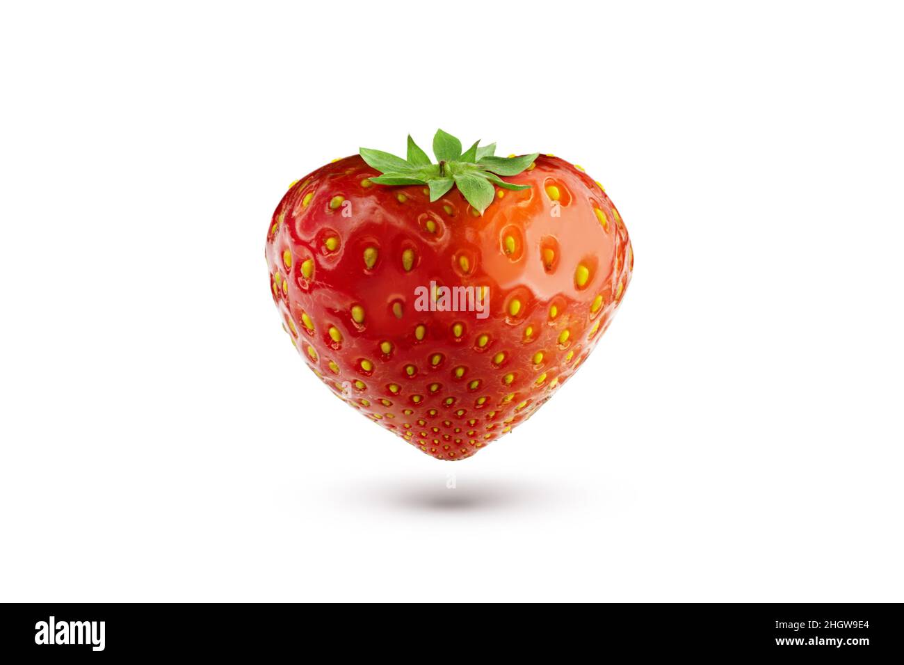 Heart shaped One Strawberry isolated on a white background Stock Photo ...