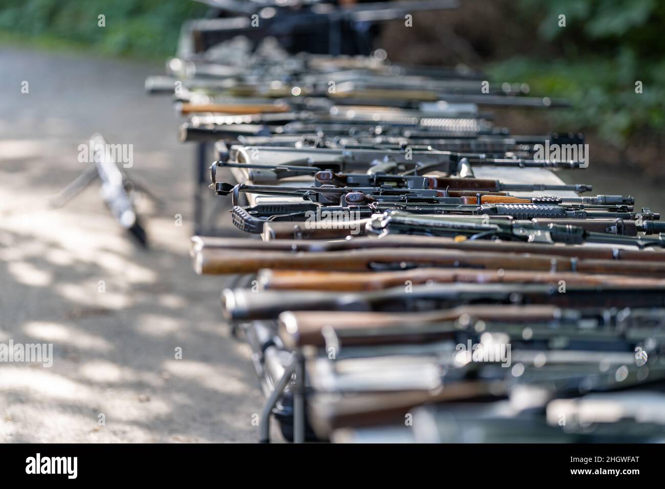 collection of historical and modern weapons on the shooting range Stock ...