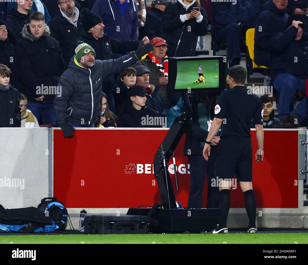 London, England, 22nd January 2022. Referee Peter Bankes consults VAR ...