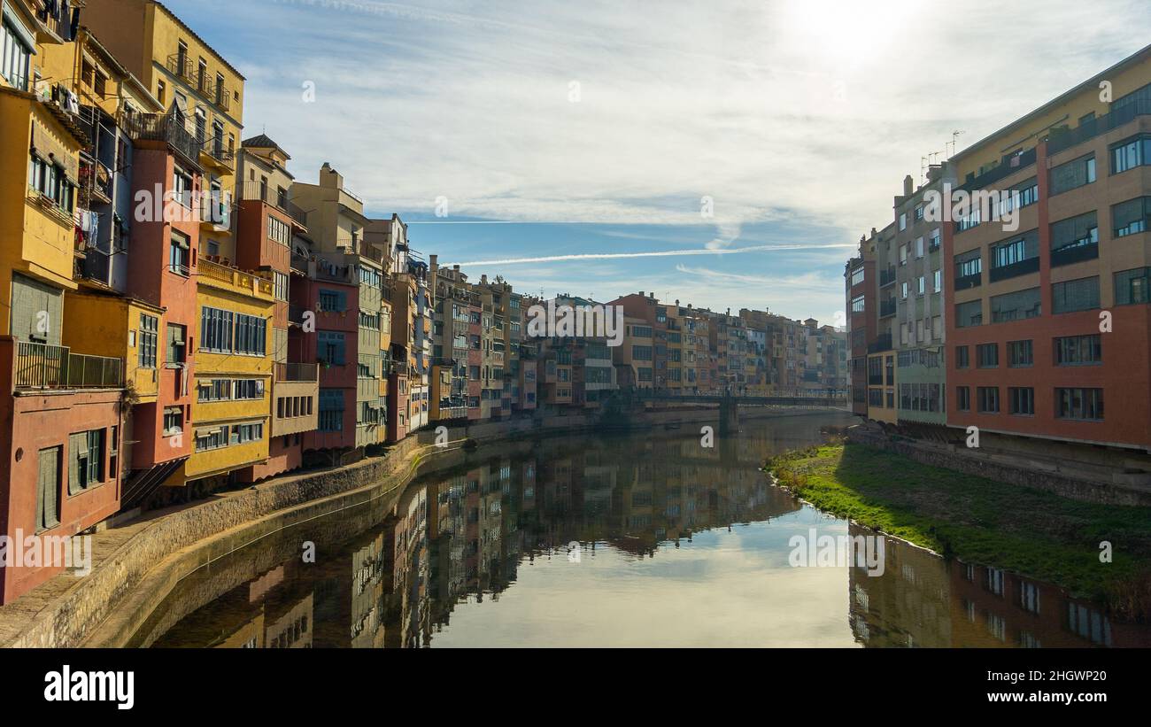 Girona cityscape views of the river and the colorful buildings next to ...