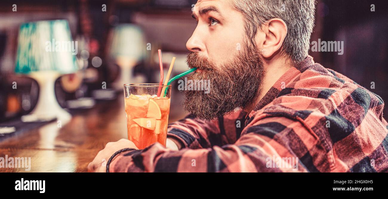 Tropical alcoholic fresh cocktail. Barman in pub or restaurant. Bearded ...